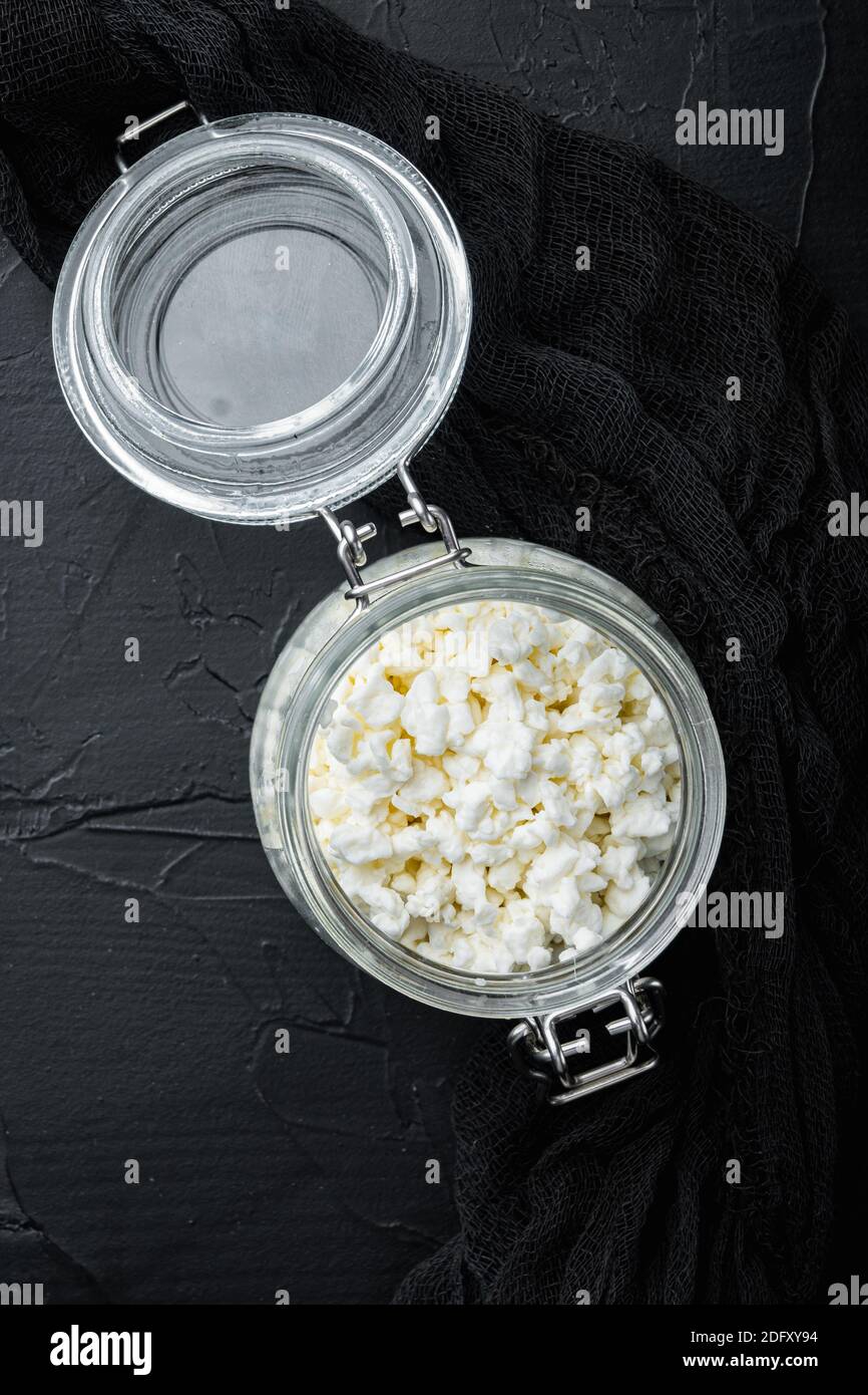 Cottage cheese, curd, on black textured background, top view Stock ...