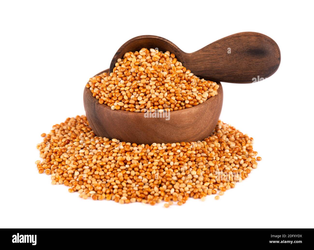 Millet in wooden bowl and spoon, isolated on white background. Unpeeled ...