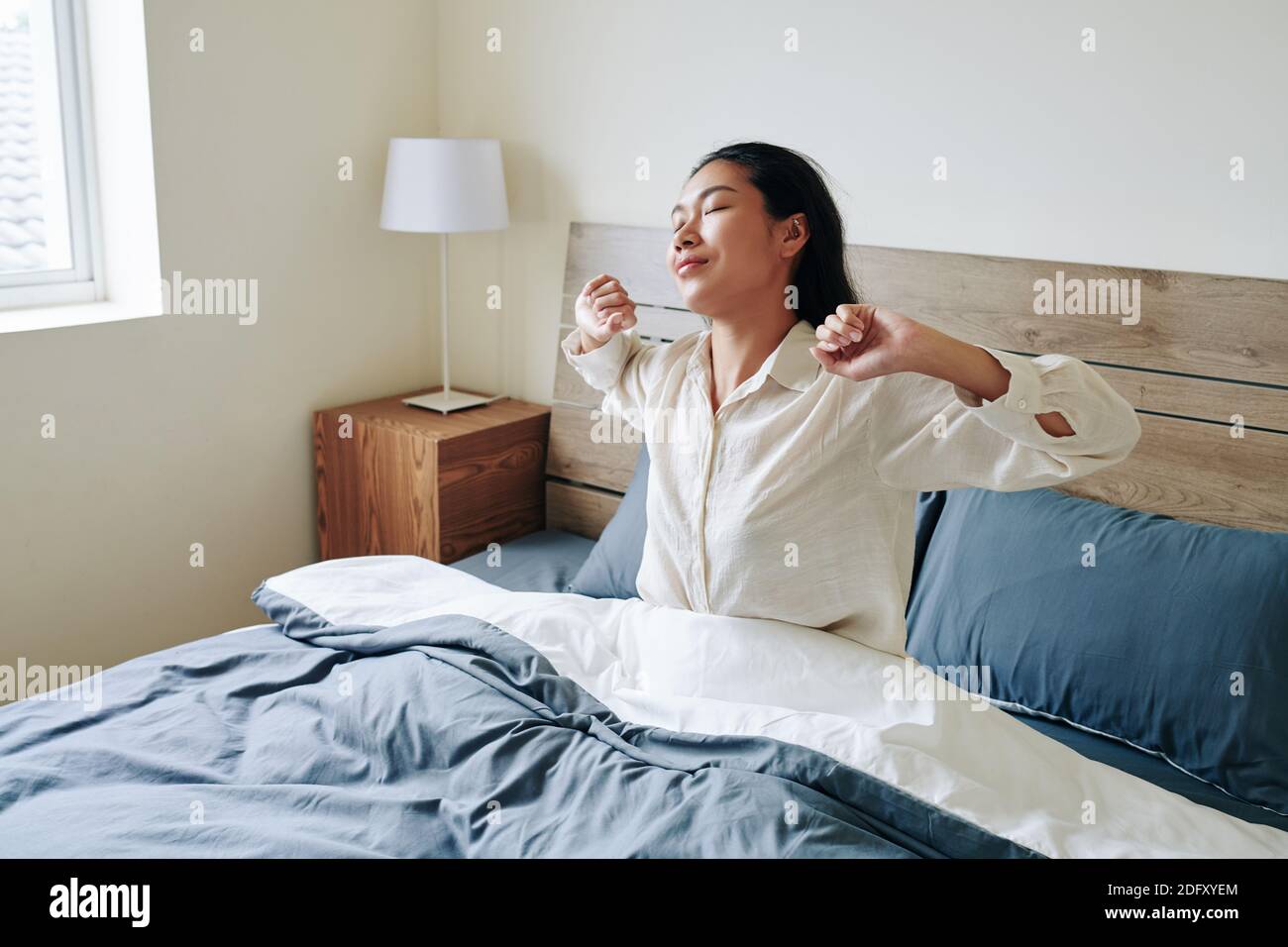 Stretching bed women hi-res stock photography and images - Alamy