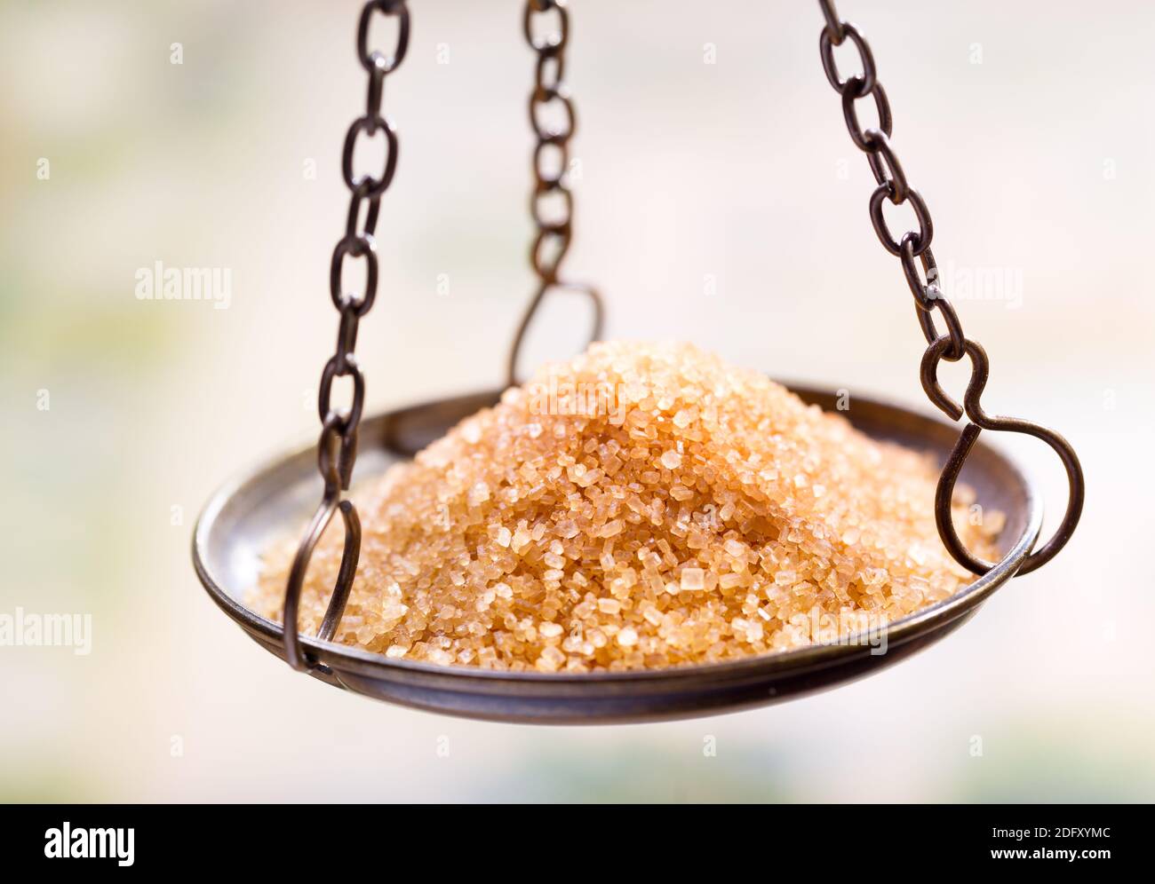 brown sugar in balance scale Stock Photo - Alamy