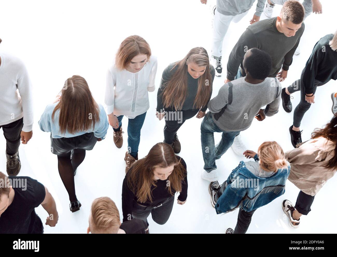 top view . young people moving in opposite directions Stock Photo - Alamy