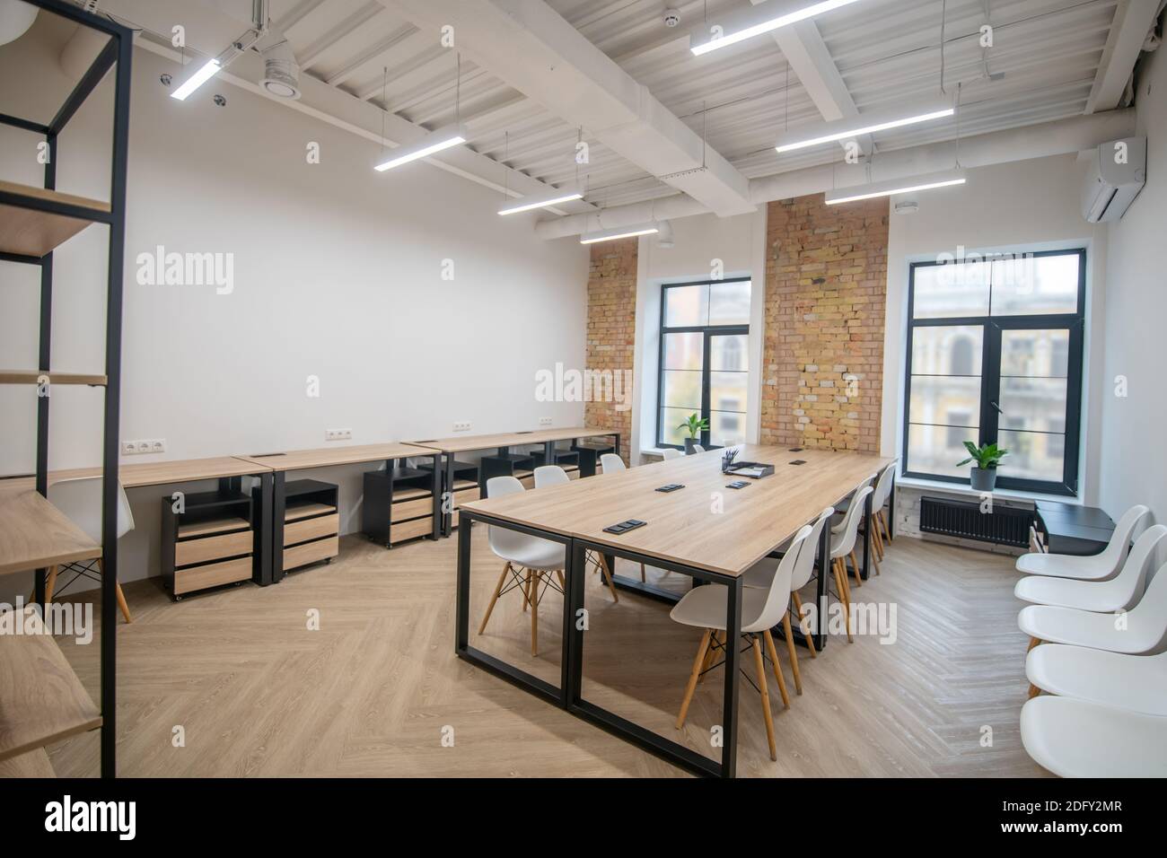 Light office with new furniture and striplights Stock Photo - Alamy