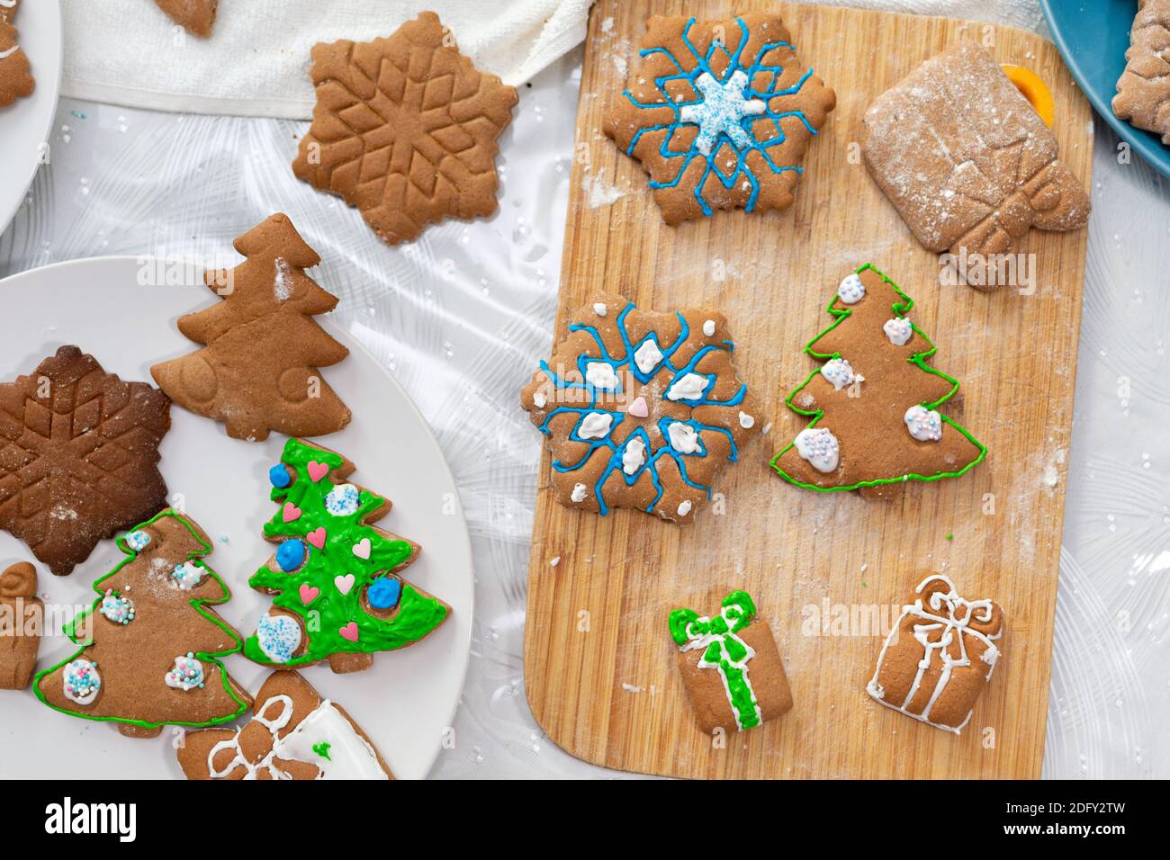 Christmas decorations. Gingerbreads decorated with powdered sugar on a ...