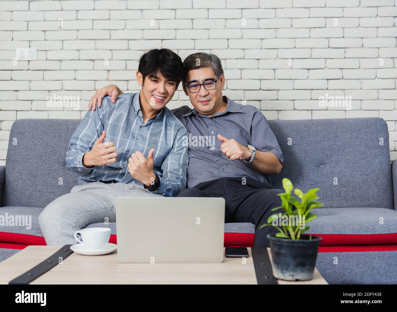 Asian senior businessman with laptop computer discuss together with ...