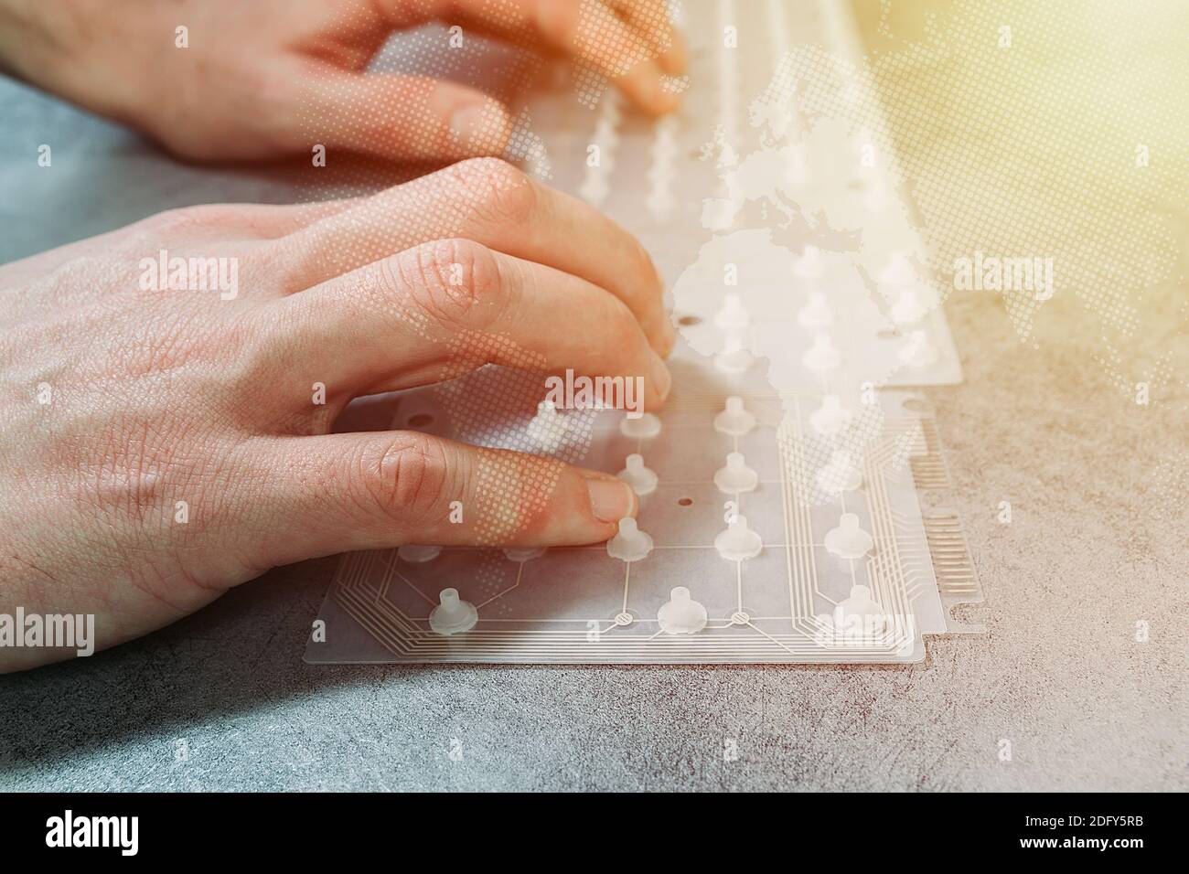Man hand typing on modern slim futuristic keyboard on desk with dotted ...