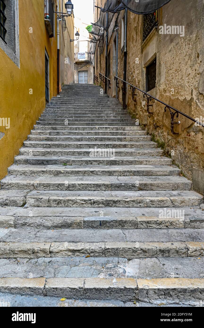 narrow stone stairs with railing between stone walls Stock Photo - Alamy