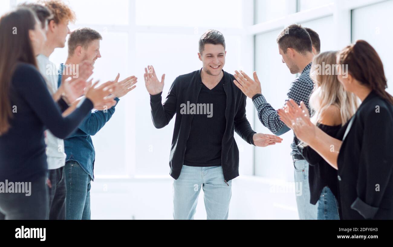 smiling leader accepting the congratulations of his business team Stock ...