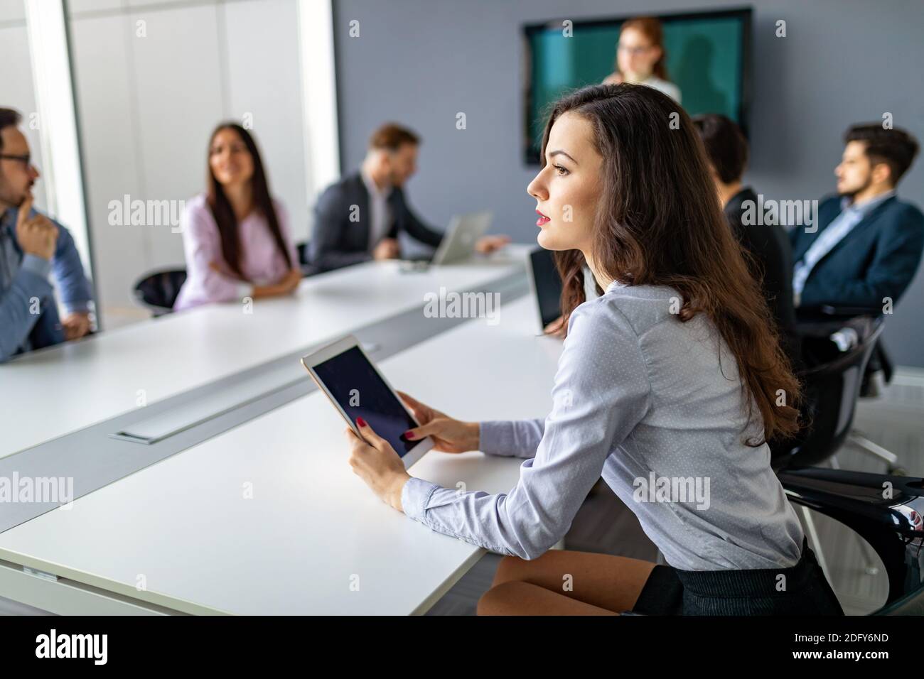 Business people having board hi-res stock photography and images - Alamy