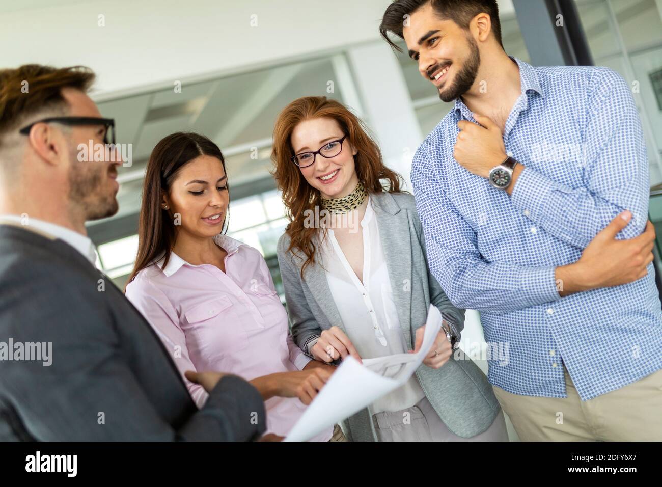 Group business people discussing documents hi-res stock photography and ...