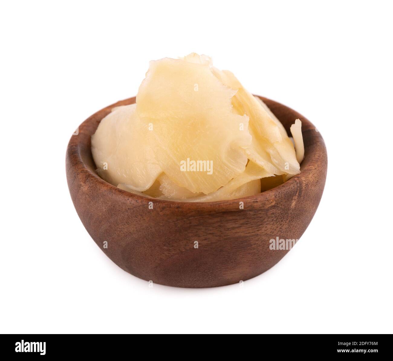 Pickled ginger slices in wooden bowl, isolated on white background ...