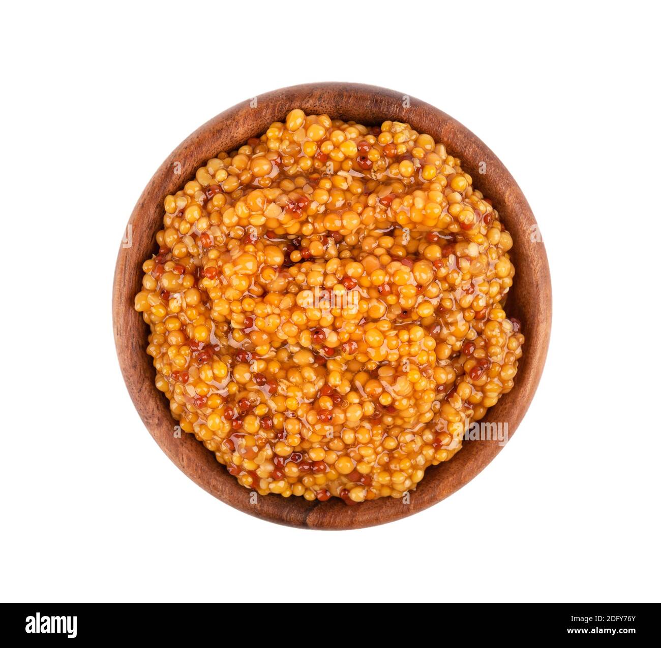 Grain mustard sauce in wooden bowl, isolated on white background ...