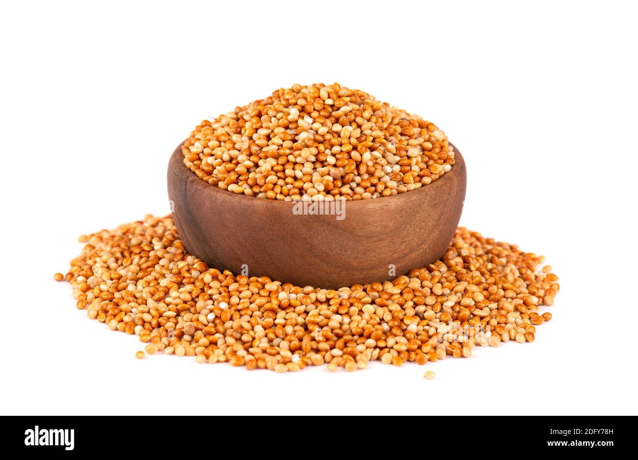 Millet in wooden bowl, isolated on white background. Unpeeled millet ...