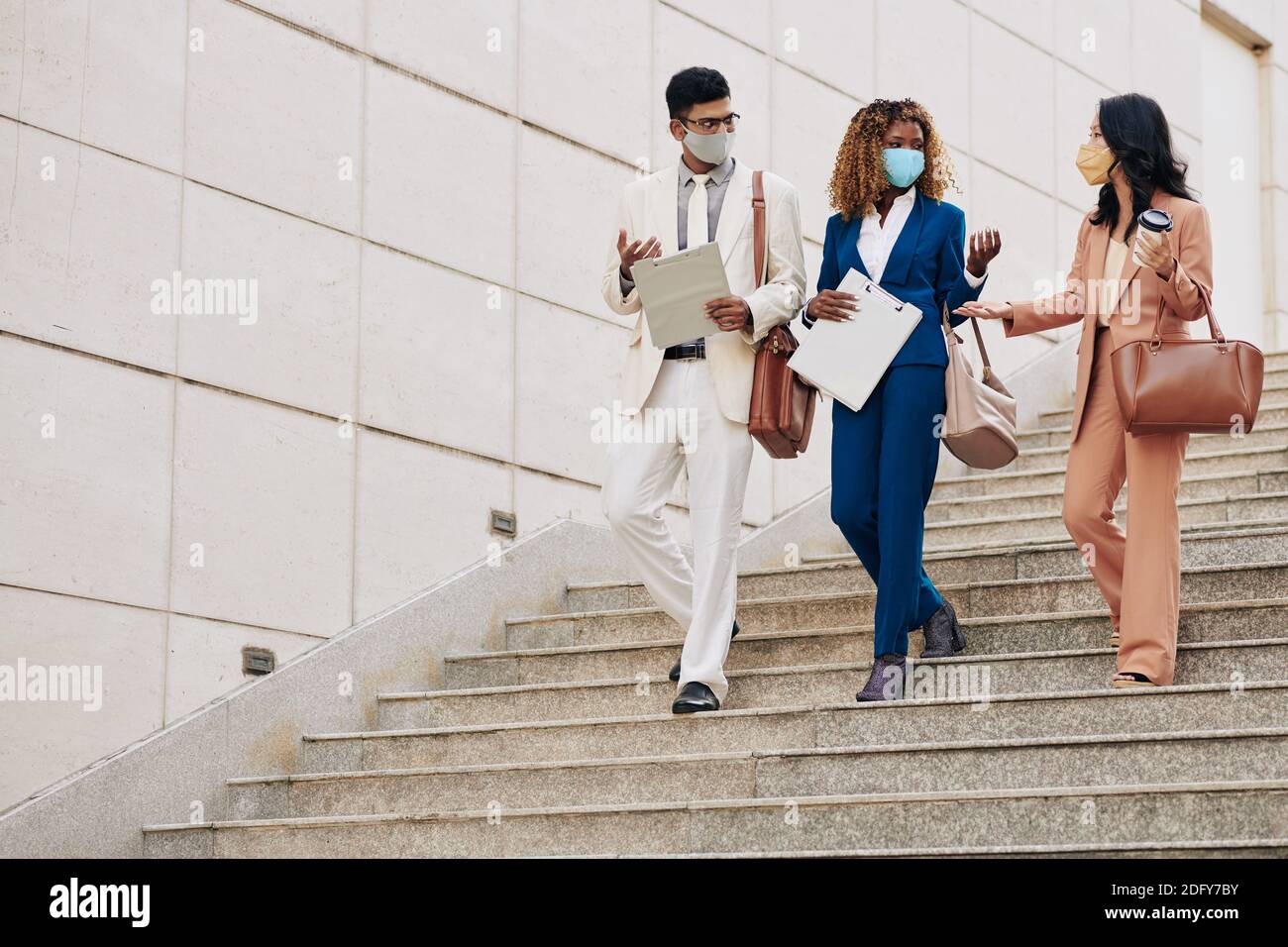 Male entrepreneur discussing walking hi-res stock photography and ...