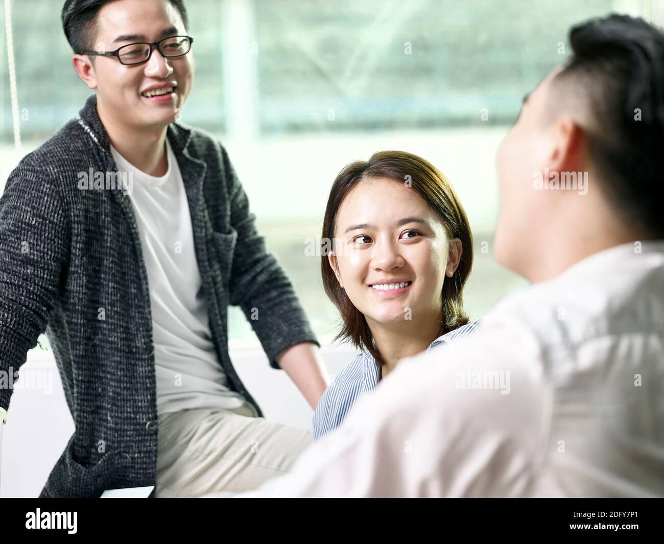 team of asian men and woman discussing business in office Stock Photo ...