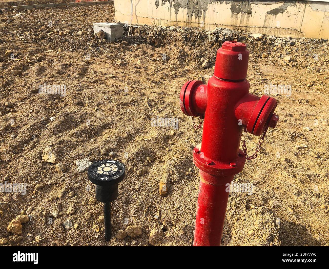 Red fire hydrant at construction site. Fireman equipment Stock Photo ...