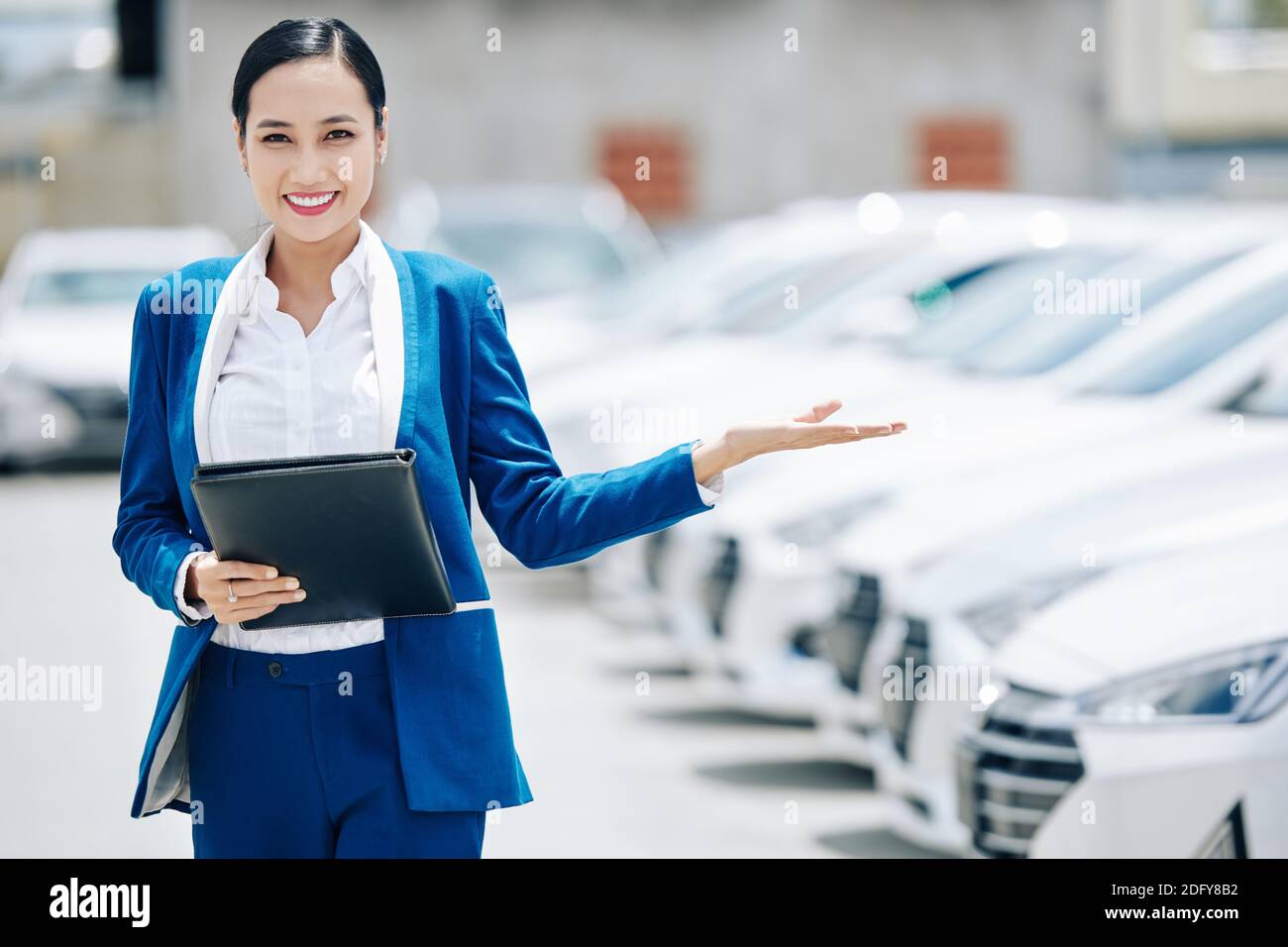 Asian car dealership manager Stock Photo - Alamy