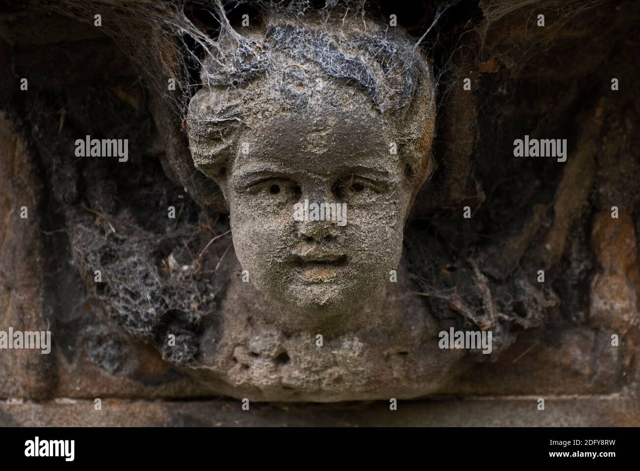 Cherub's head sculpted on a memorial in the Canongate Kirkyard ...