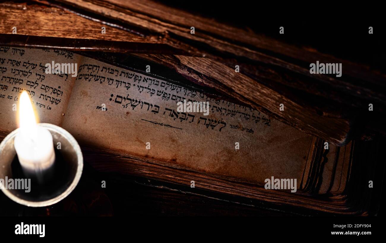 Old jewish books on open page of Makhzor with Jewish prayer L'Shana ...