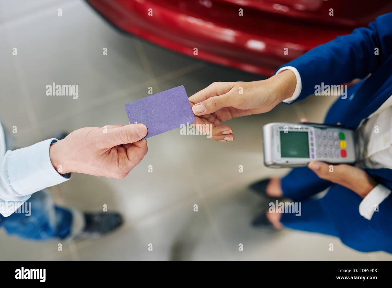 Customer paying for car Stock Photo - Alamy