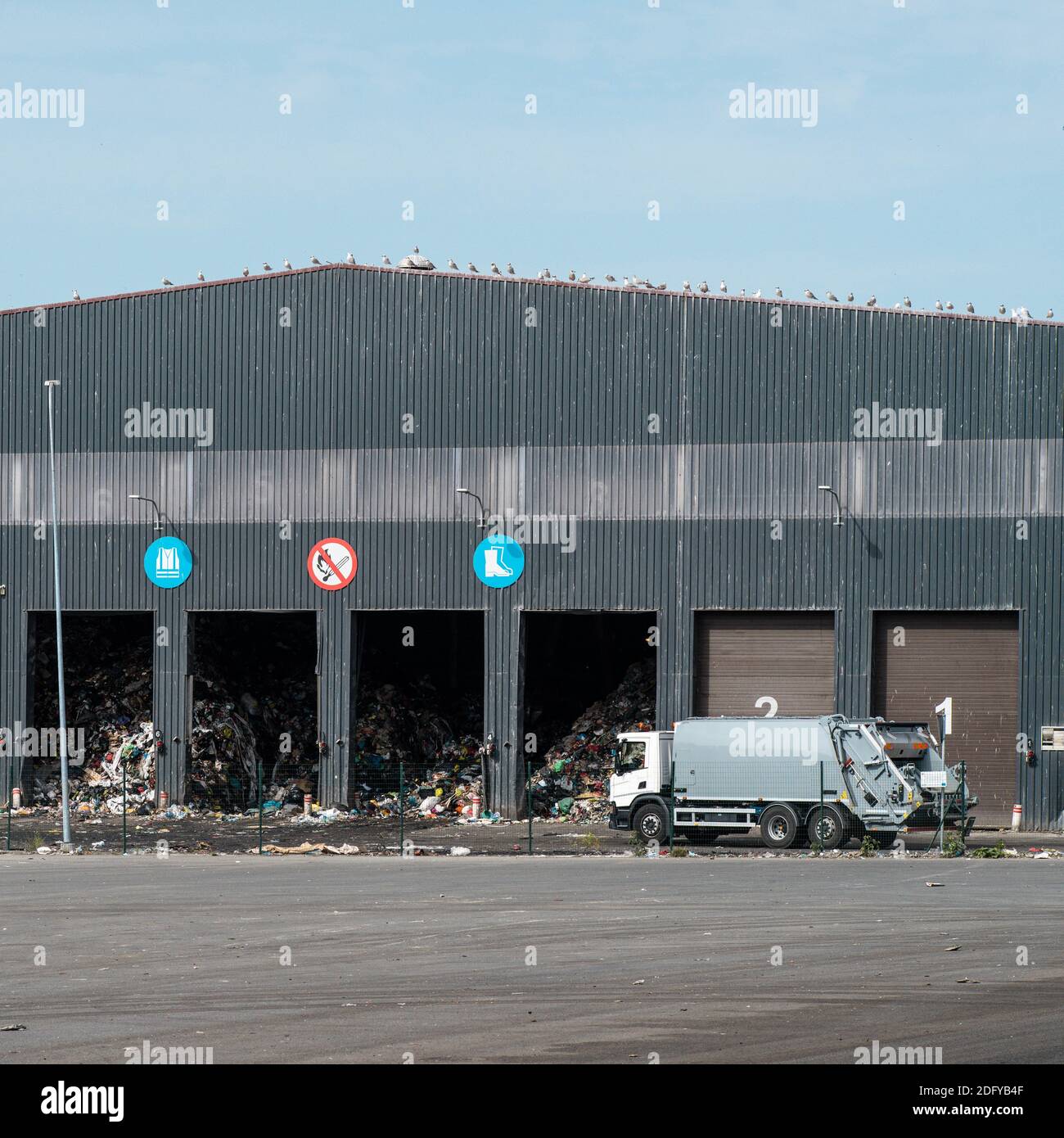 Huge warehouse of sorted household waste. Recycling. Caring for ...