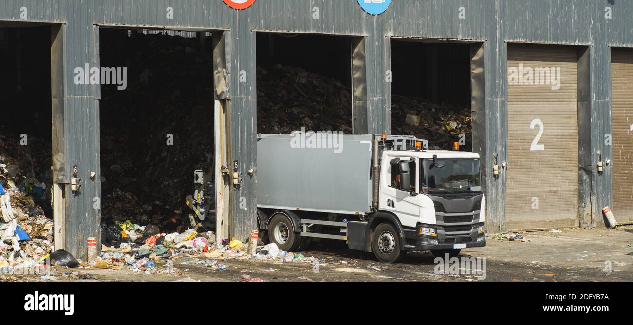 Huge industrial warehouse of household waste. Dump of big city. White ...