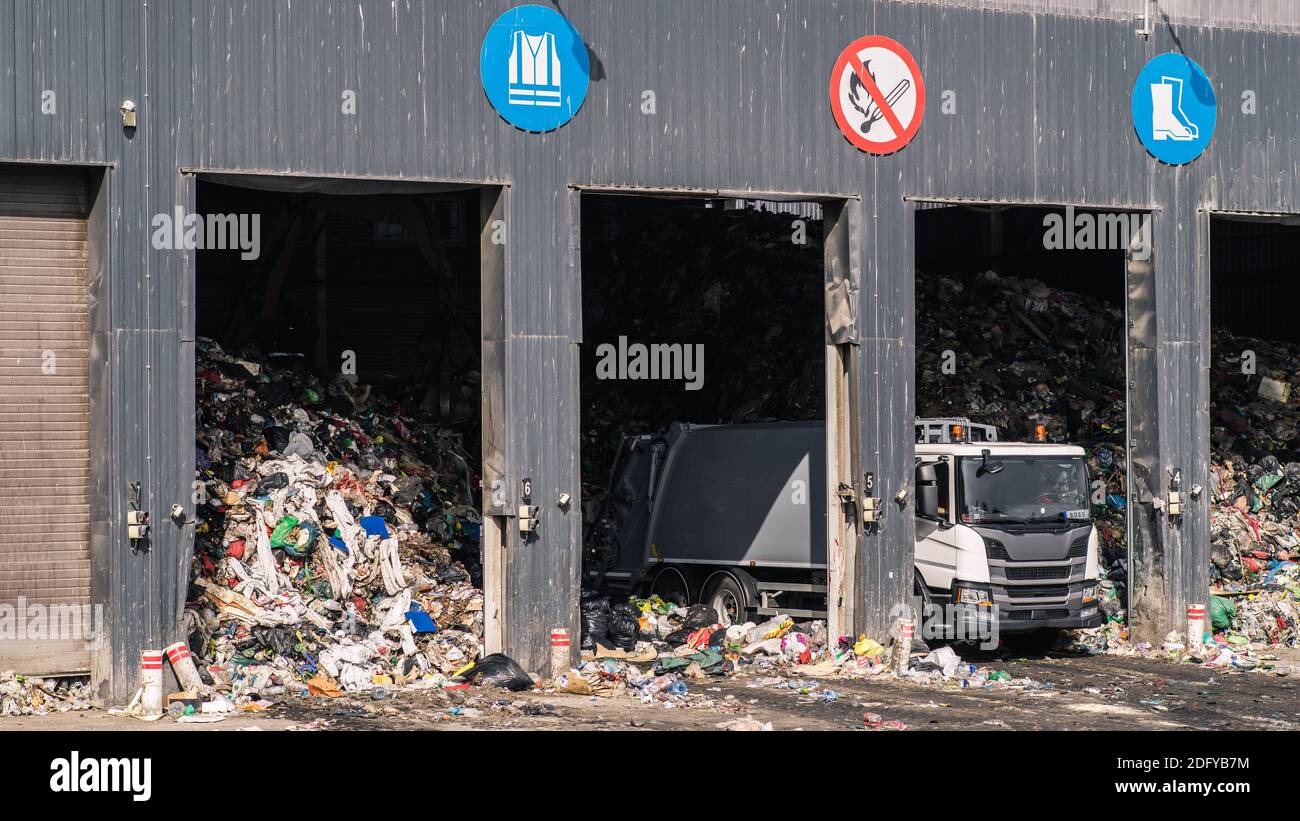 Huge industrial warehouse of household waste. Dump of big city. White ...