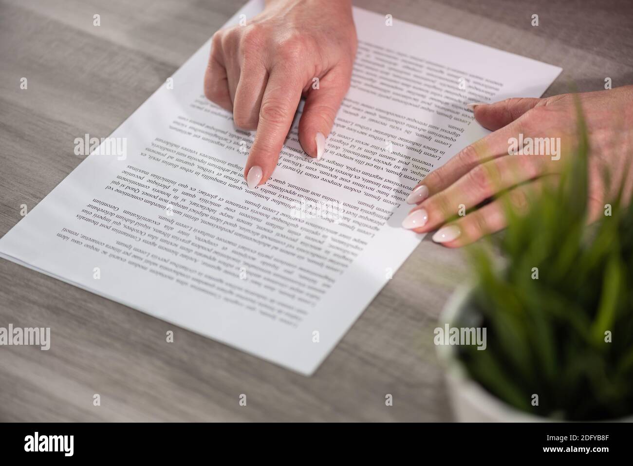 Hands of woman checking document ; close up Stock Photo - Alamy