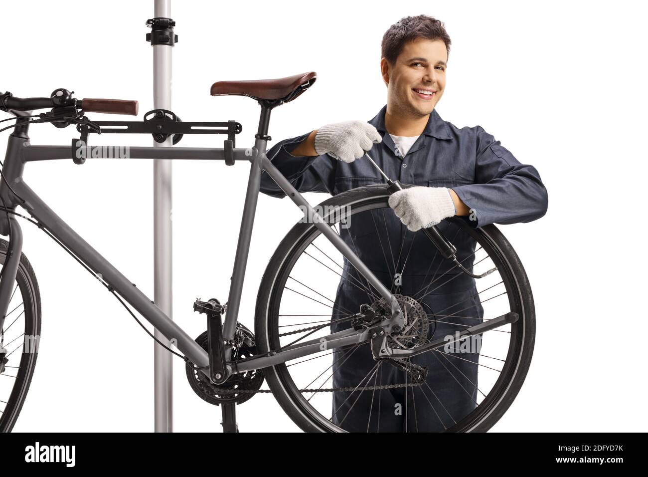 Repairman fixing a bicycle on a stand isolated on white background ...