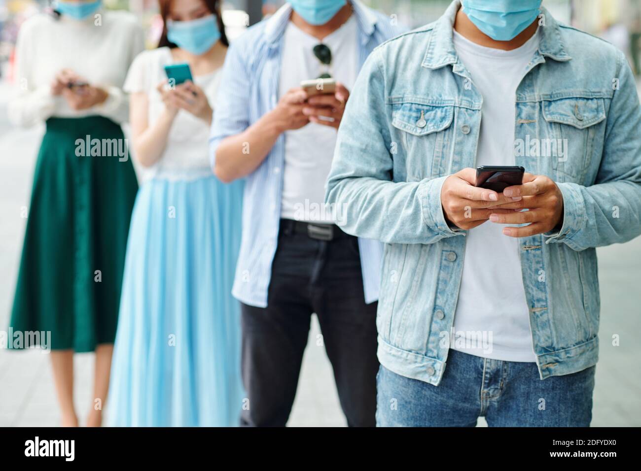Young people texting Stock Photo - Alamy