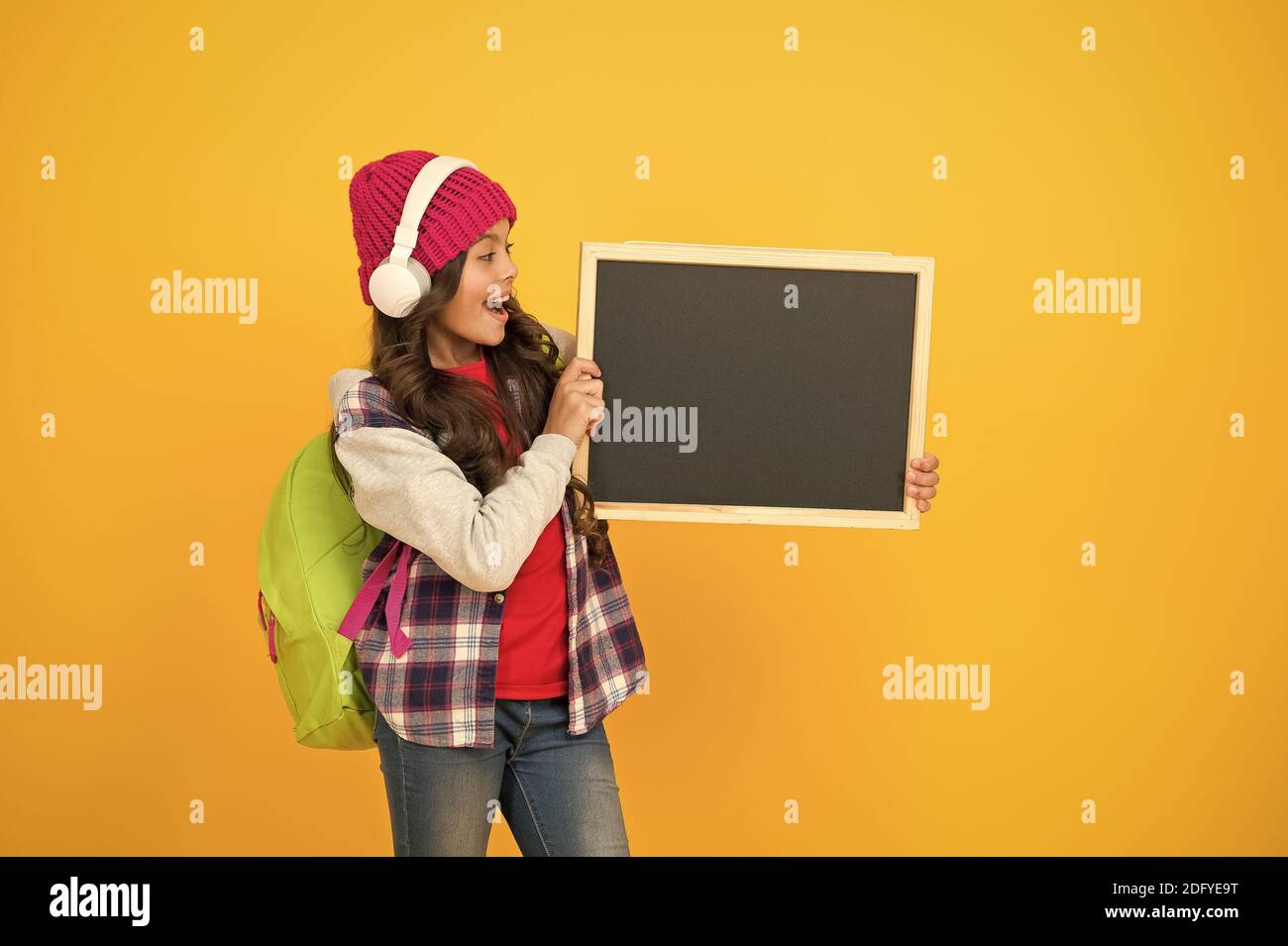 Creative school. Happy child hold school blackboard. Little girl back ...