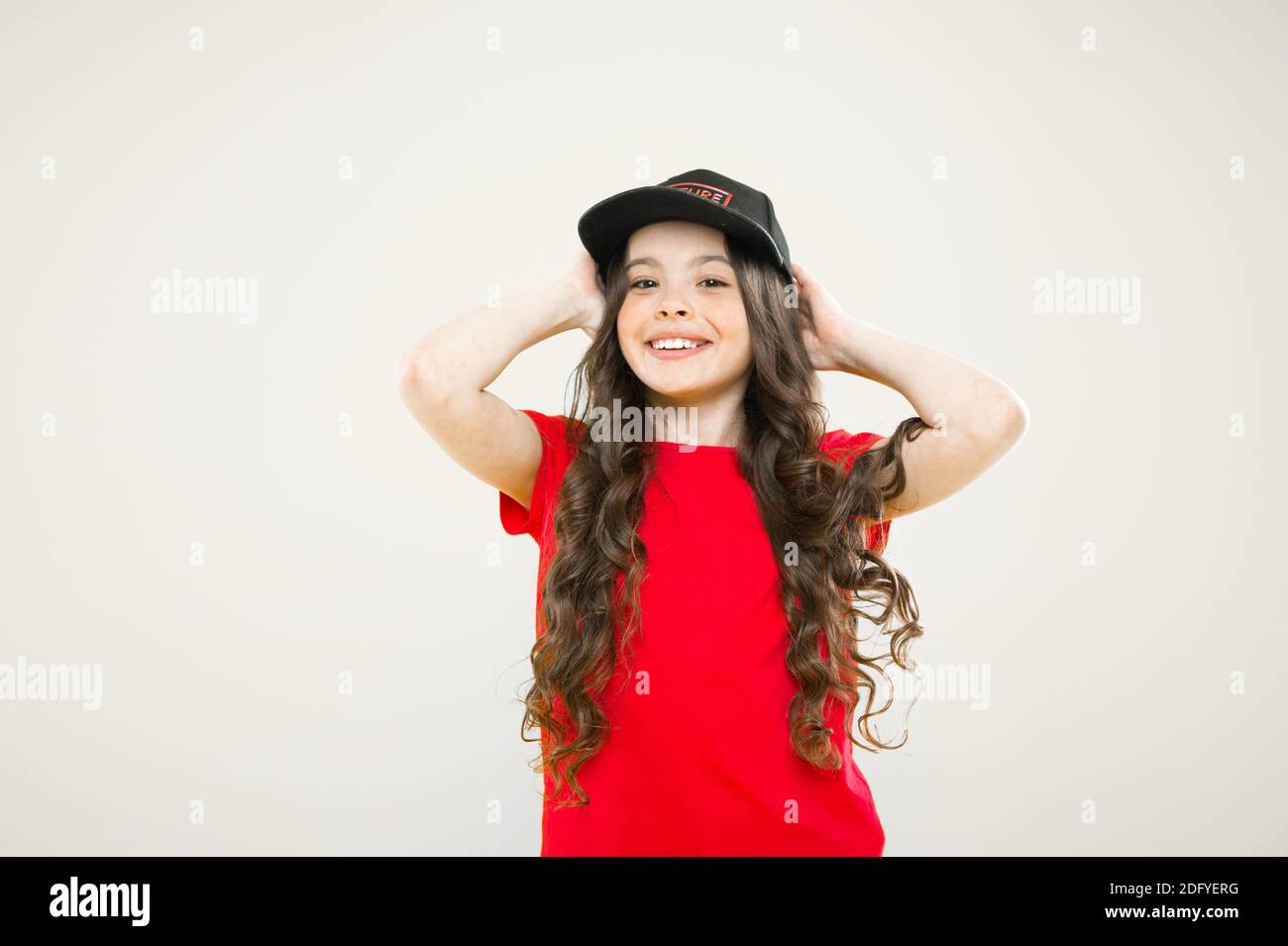 Summer sun protection cap. Girl long curly hair wear cap. Must have ...