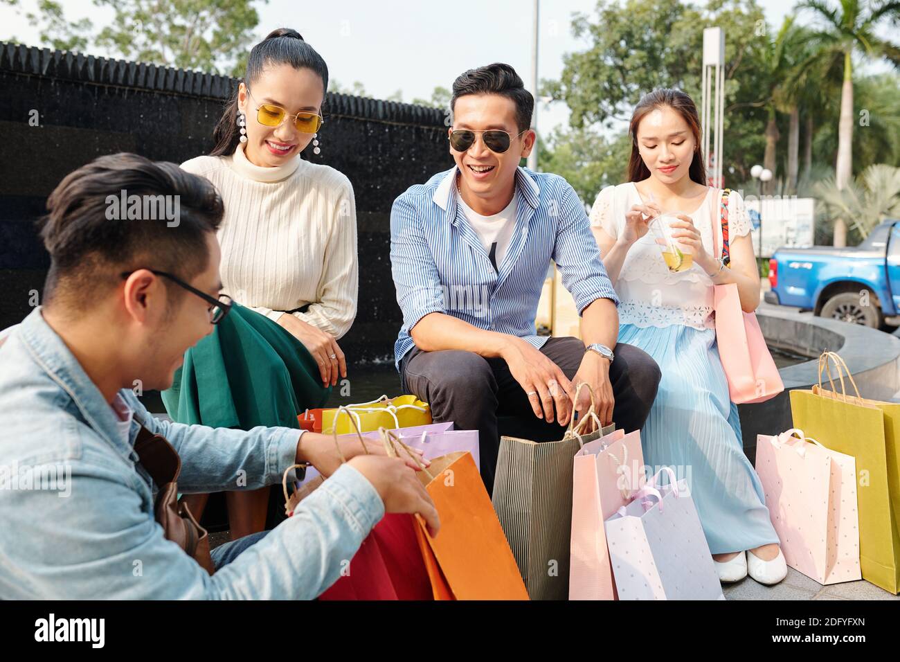Happy asian female friends discussing hi-res stock photography and ...