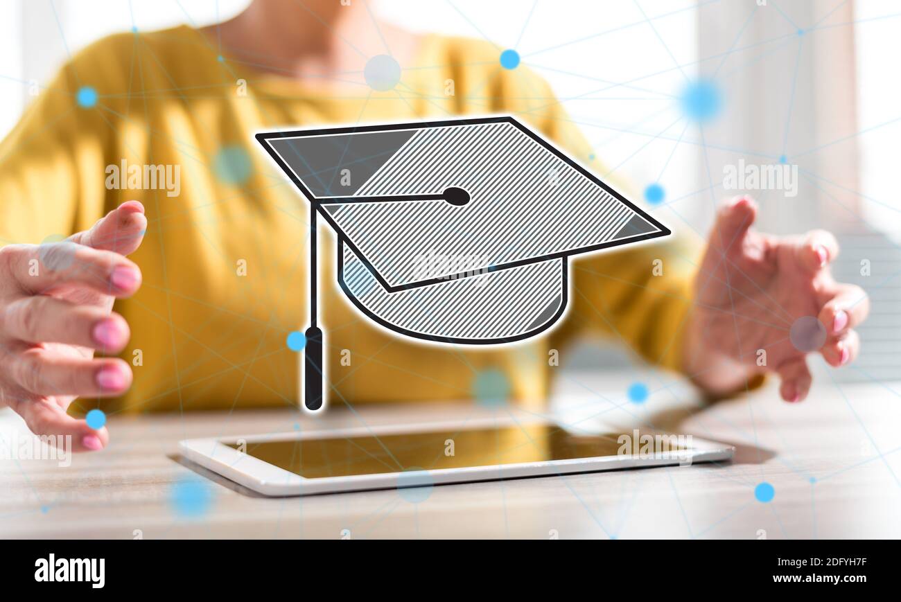 Digital tablet with graduation concept between hands of a woman in ...