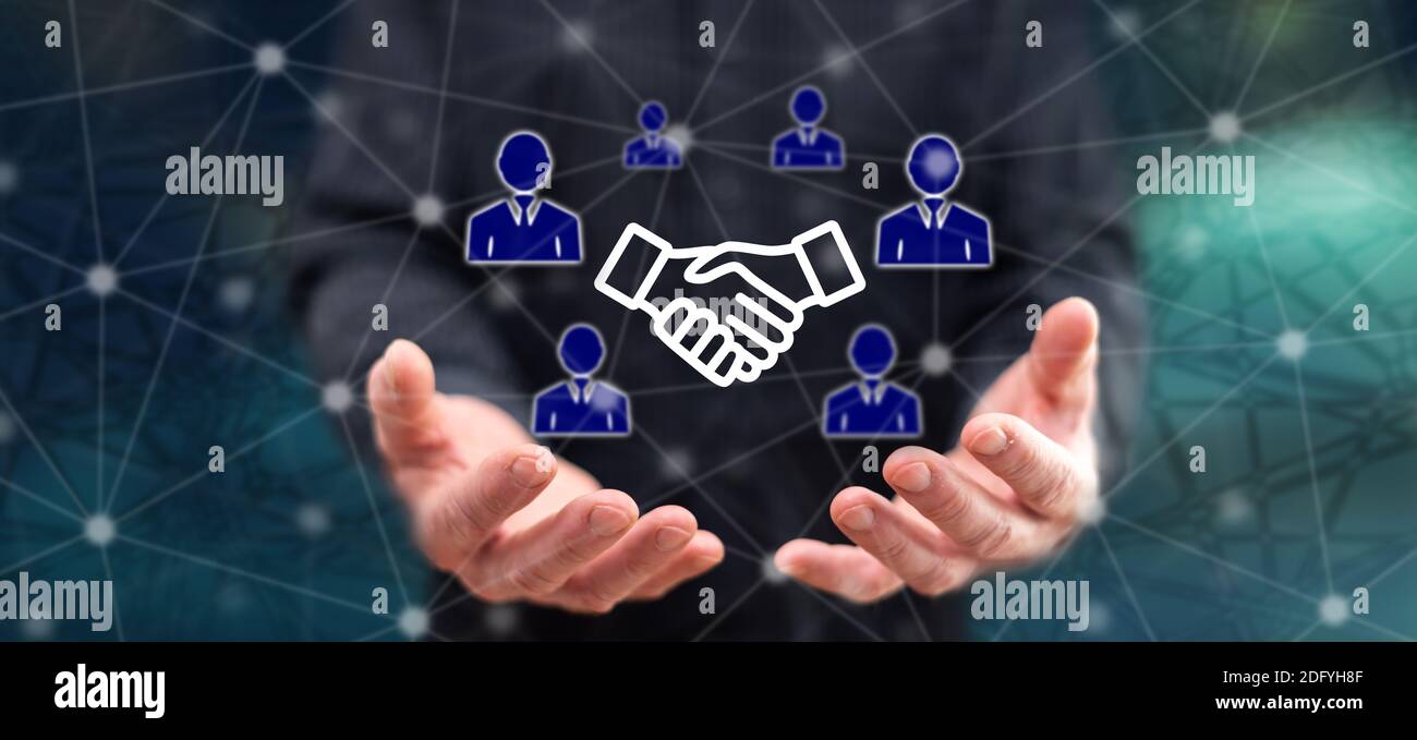 Partner concept above the hands of a man in background Stock Photo - Alamy