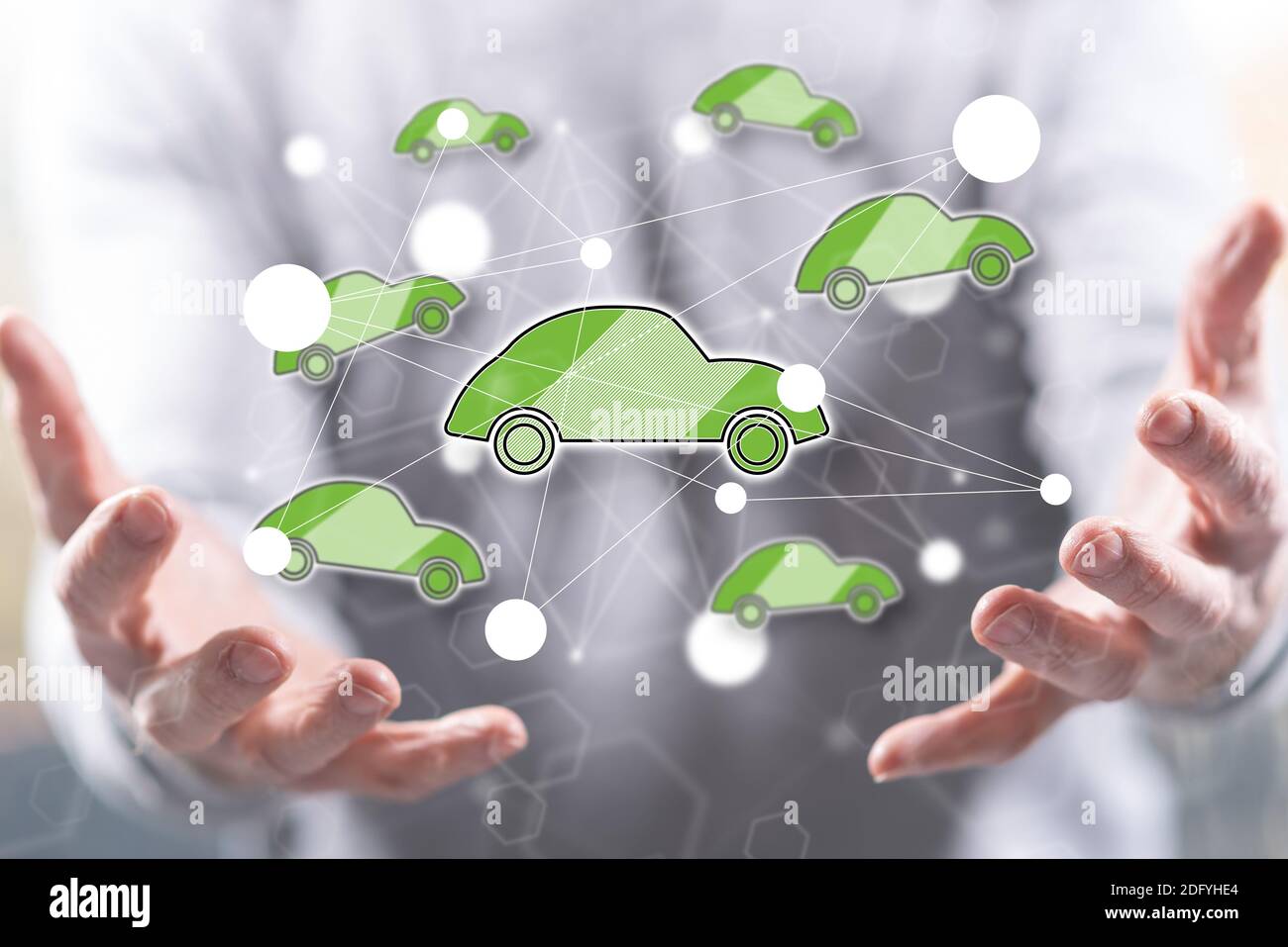 Connected car concept above the hands of a man in background Stock ...