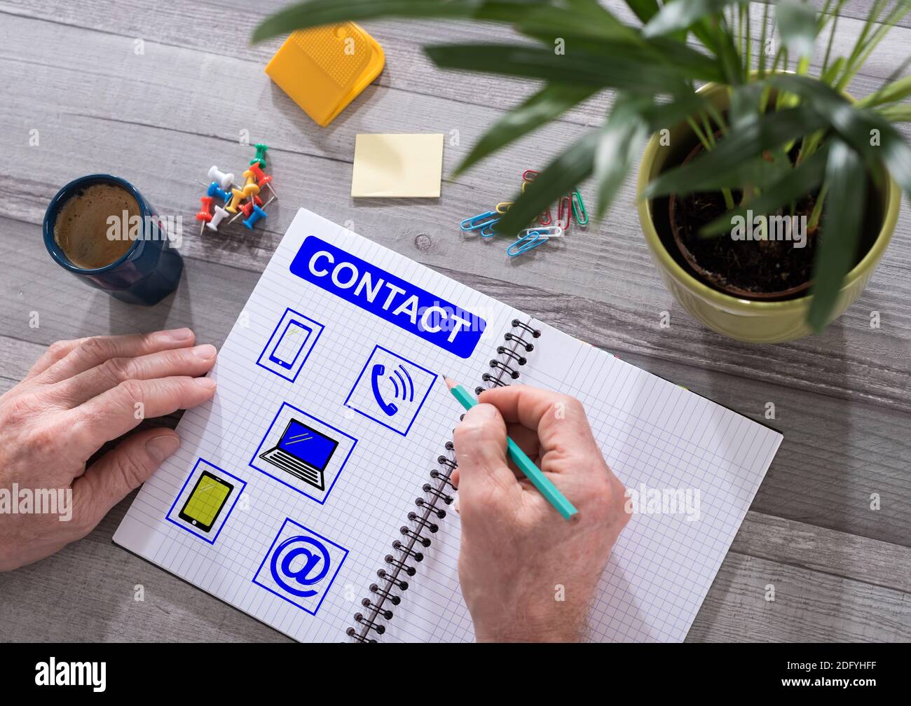 Contact concept drawn on a notepad placed on a desk Stock Photo - Alamy