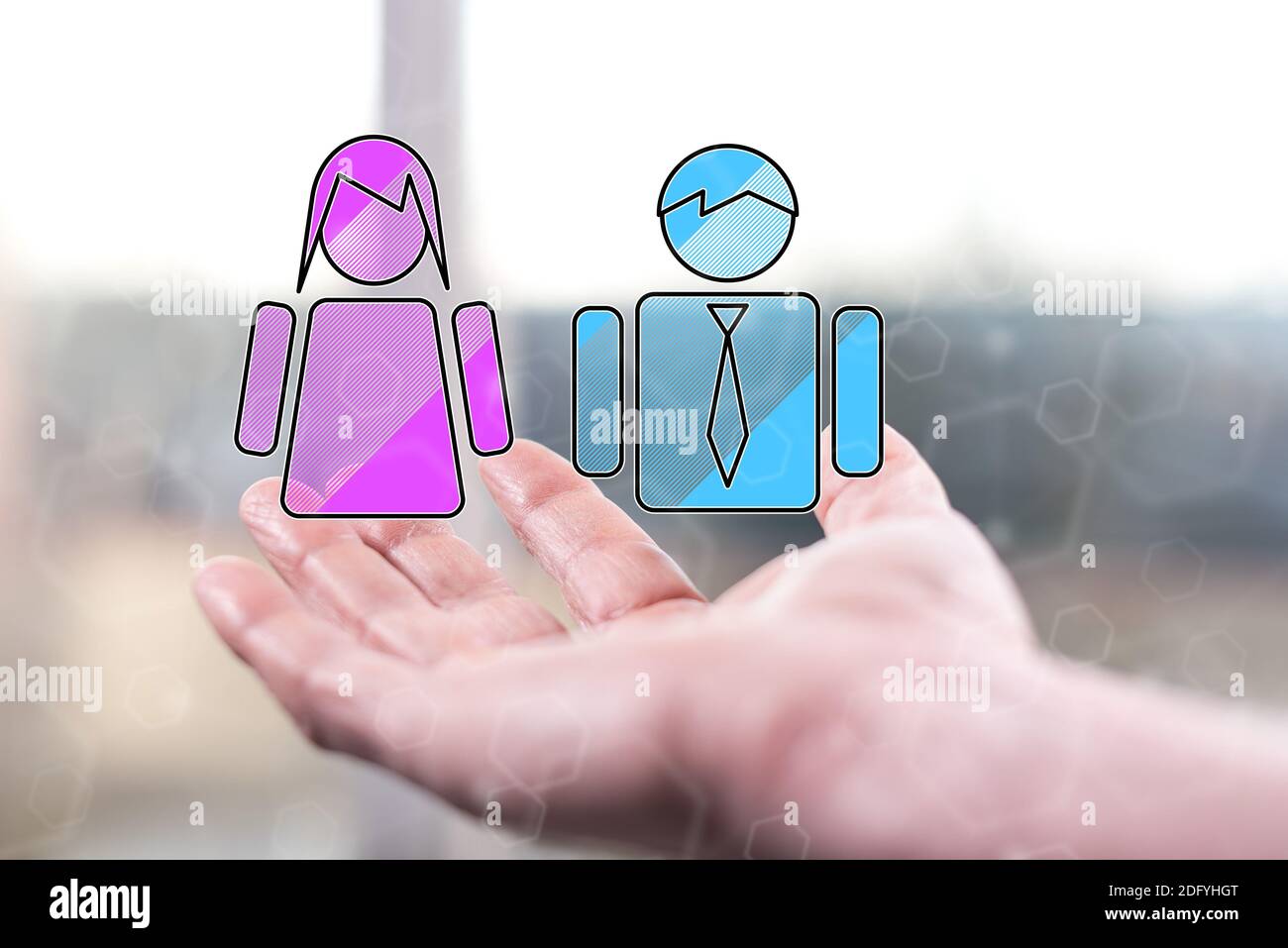 Gender equality concept above a hand of a man Stock Photo - Alamy