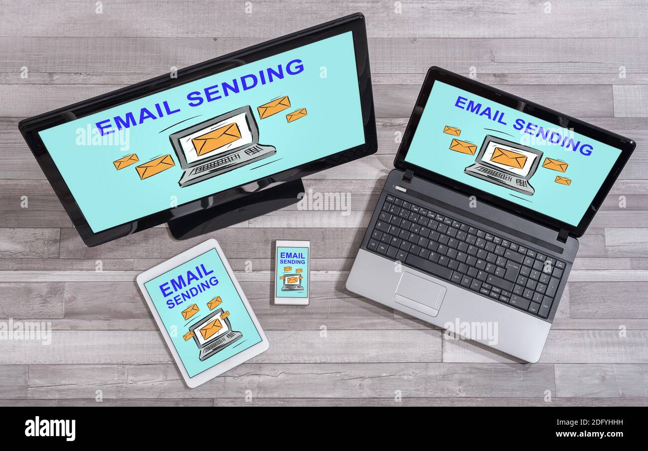 Email sending concept shown on different information technology devices ...