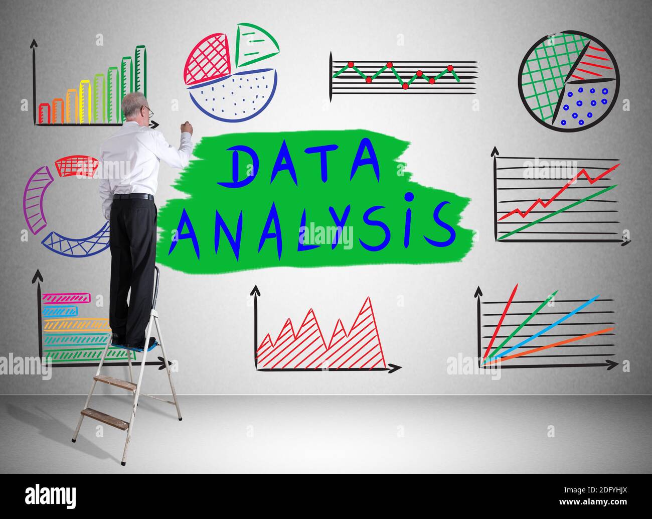 Man on a ladder drawing data analysis concept on a wall Stock Photo - Alamy