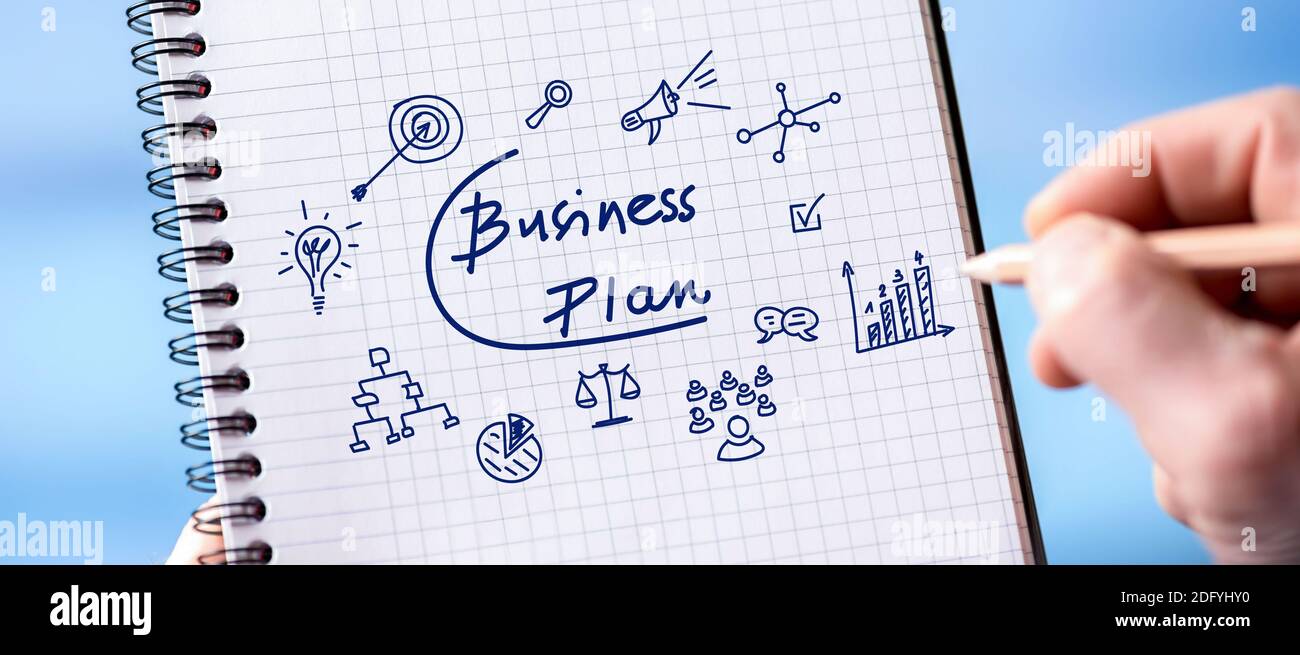 Hand drawing business plan concept on a notepad Stock Photo - Alamy