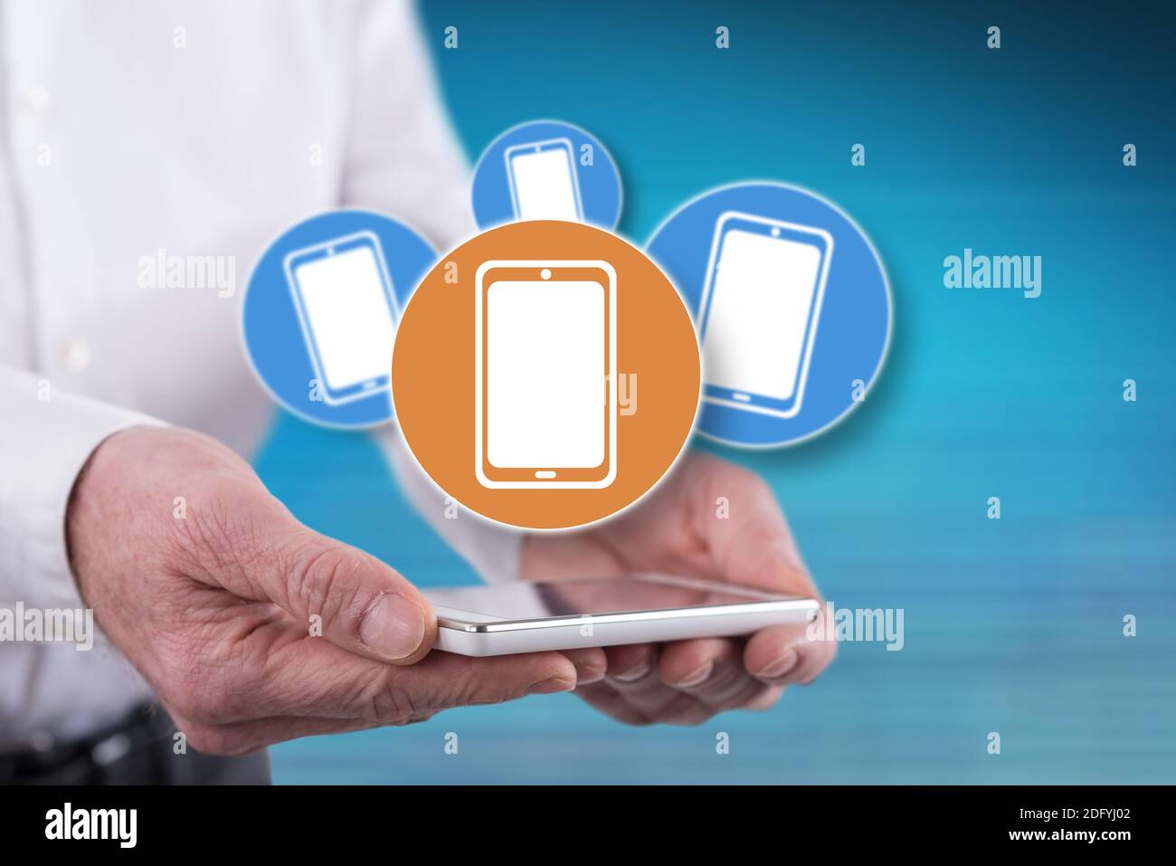 Digital communication concept above a smartphone held by hands Stock ...