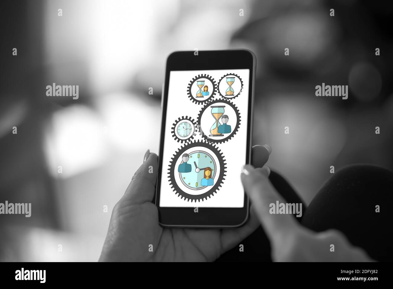 Hand holding a smartphone with time management concept Stock Photo - Alamy
