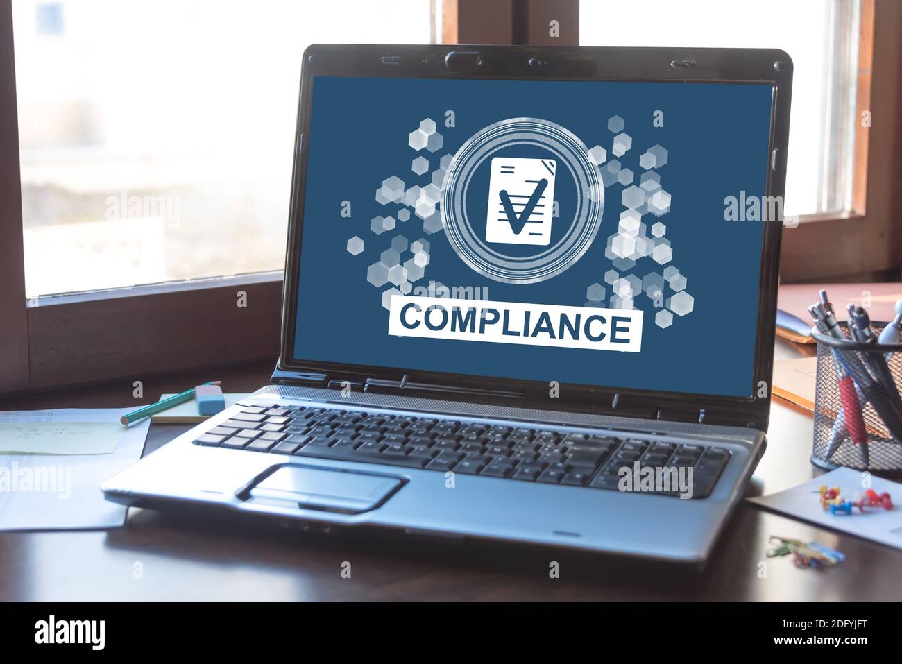 Laptop screen displaying a compliance concept Stock Photo - Alamy