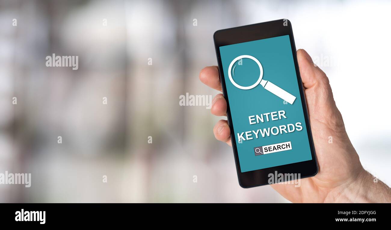 Smartphone screen displaying a keywords search concept Stock Photo - Alamy