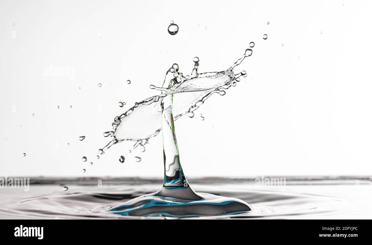 Water drop falling and impacting body of water. macro photo Stock Photo ...