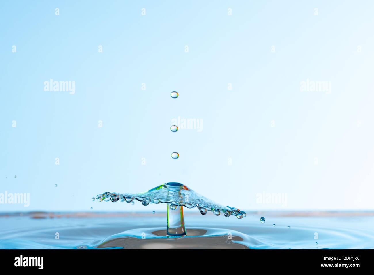 Water drop falling and impacting body of water. macro photo Stock Photo ...