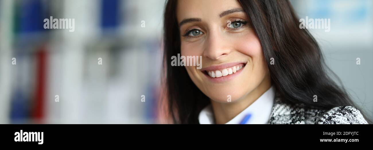 Good-looking employee in grey costume Stock Photo - Alamy