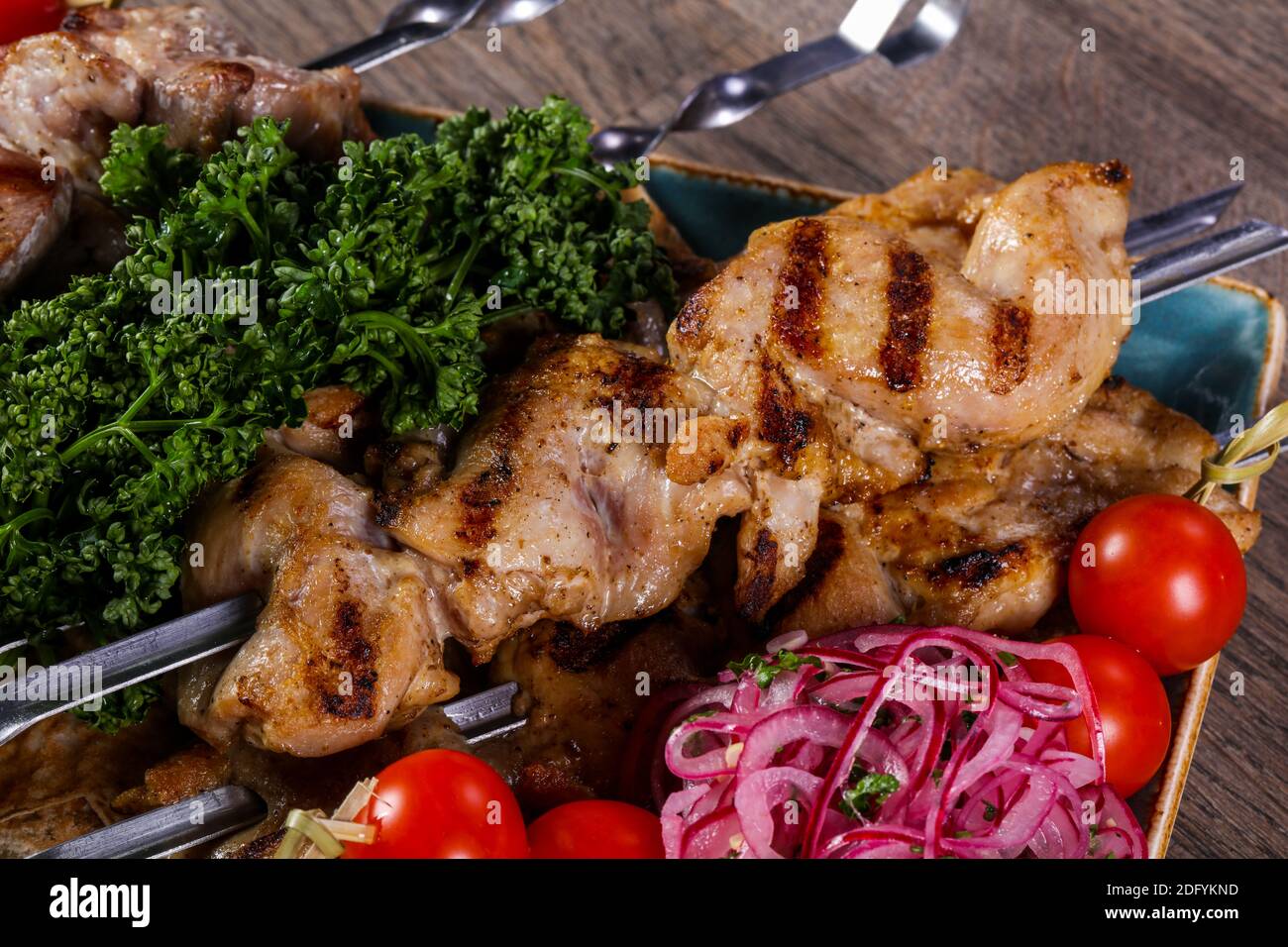 Grilled chicken and pork barbeque Stock Photo - Alamy