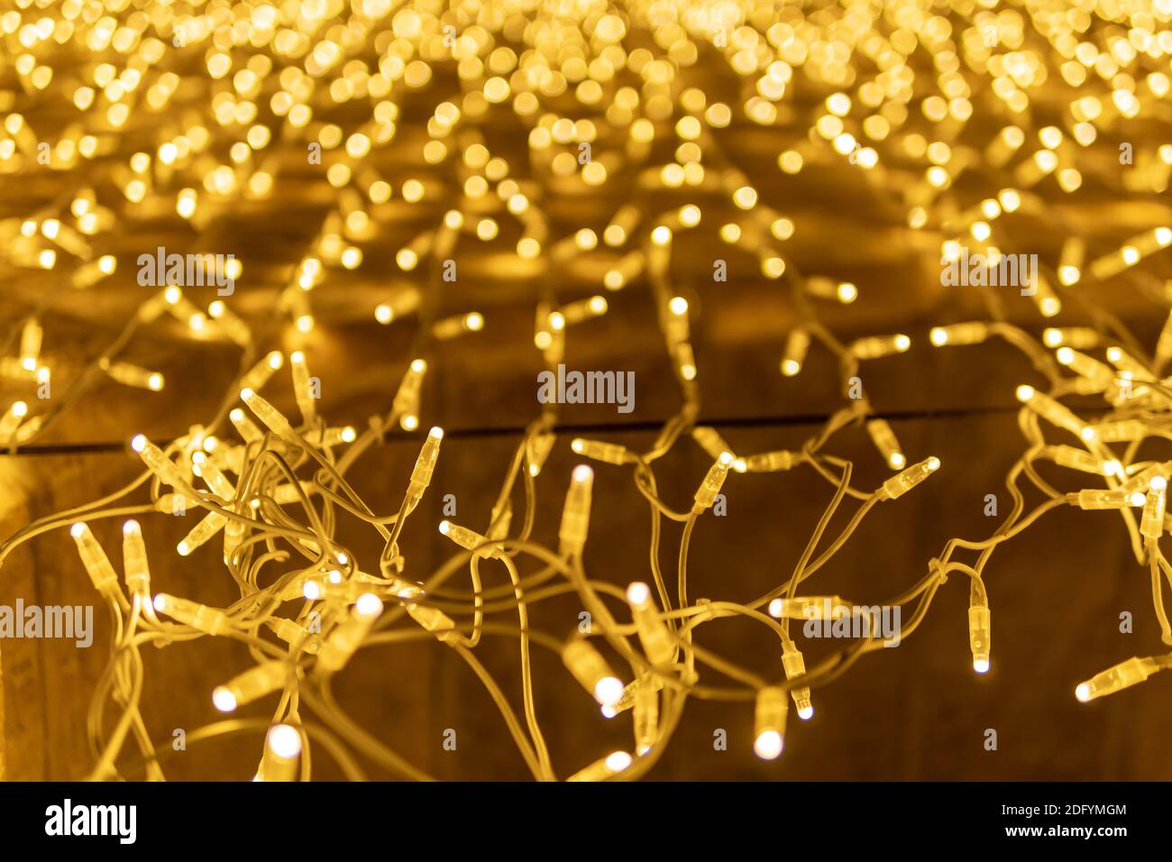 Close-up some yellow led lights decorating a facade during the ...