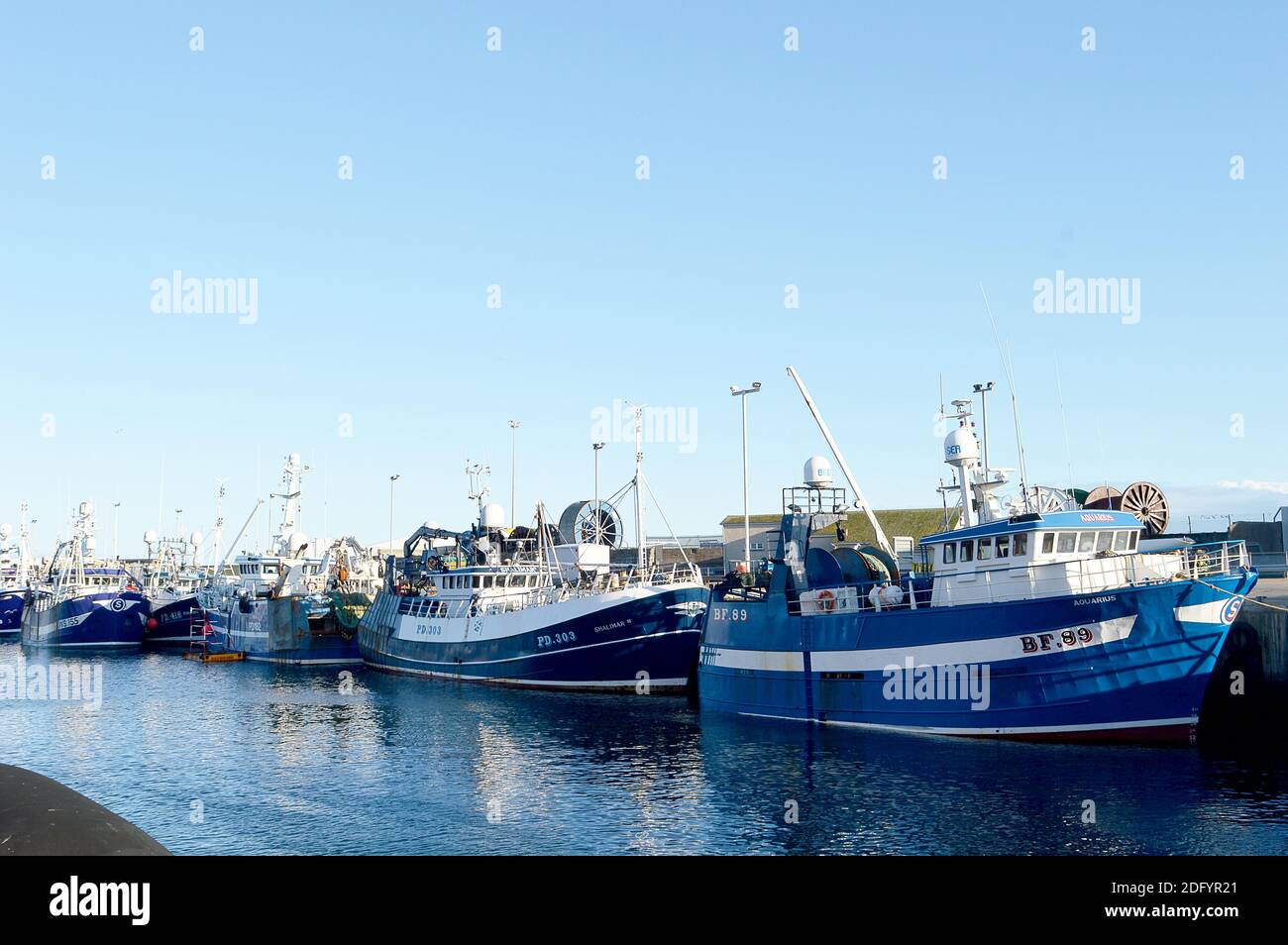 PETERHEAD, SCOTLAND - 21 NOVEMBER 2020: Fishing boats are tied up in ...